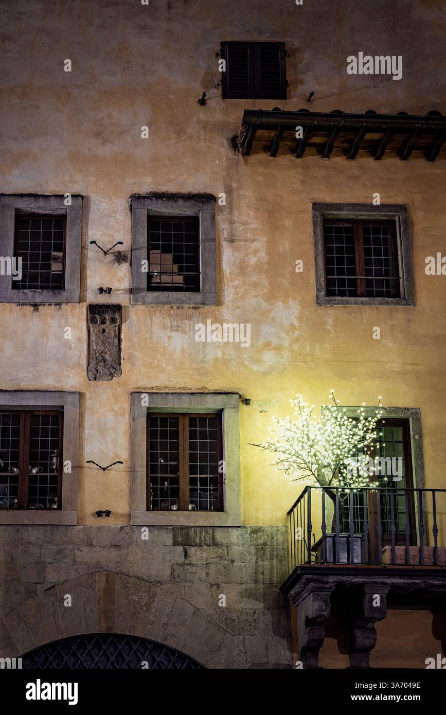 Illuminated balcony around the Ponte Veccho bridge in Florence, Italy ...