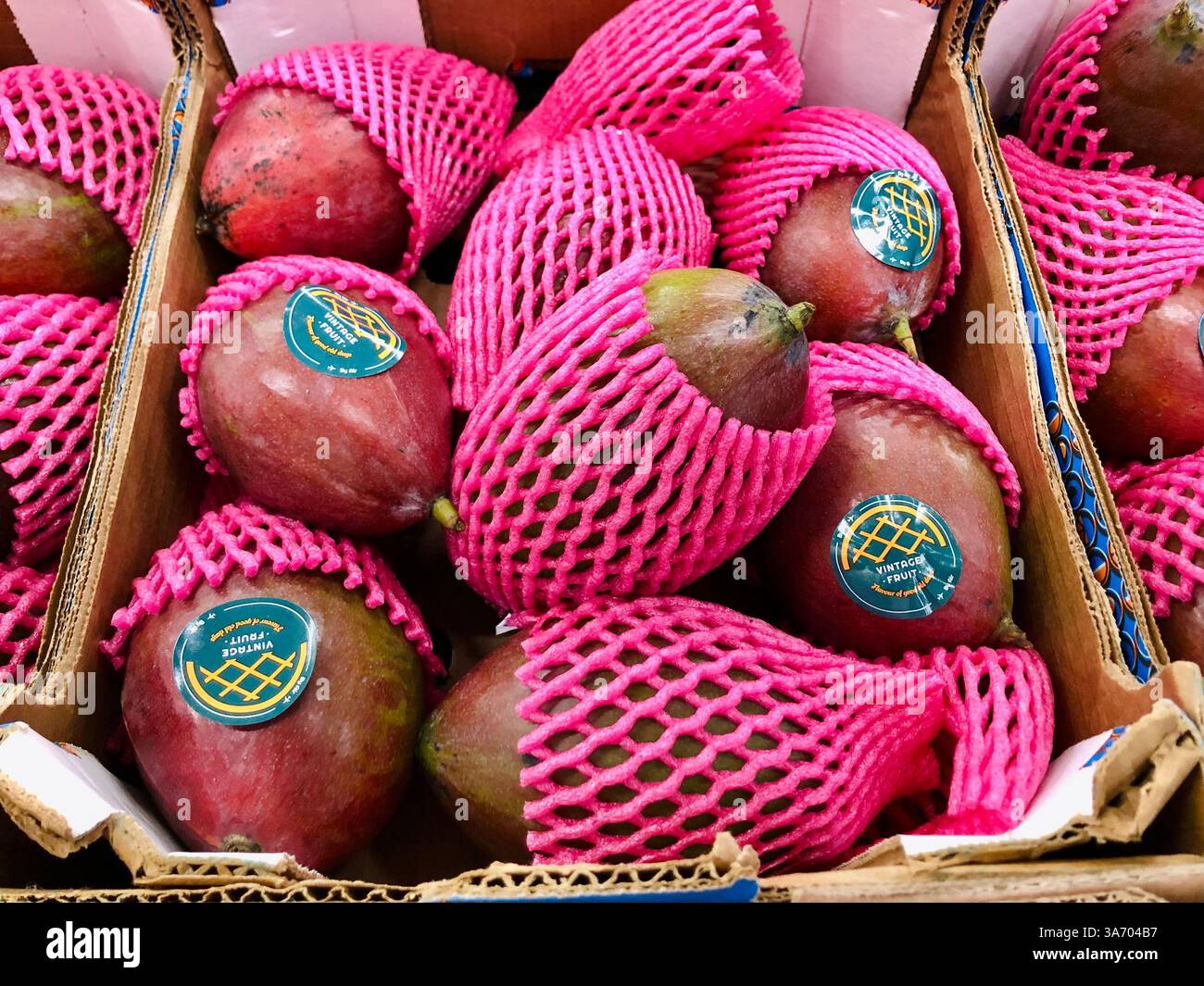Alicante, Spain - March 25, 2025: Mango fruit in bright packaging in ...
