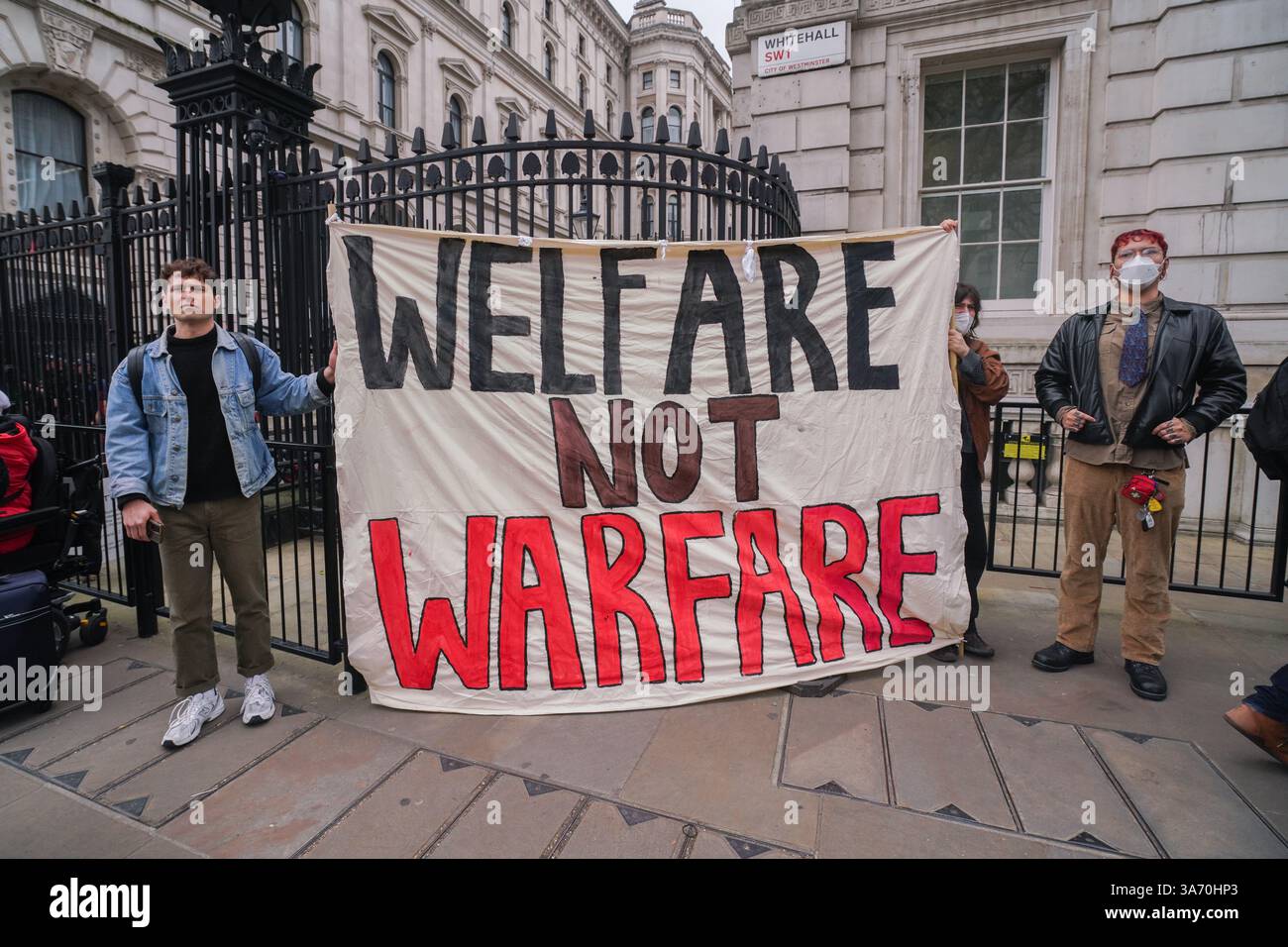London, UK 26 March 2025. Protesters hold a banner Welfare not Warfare ...