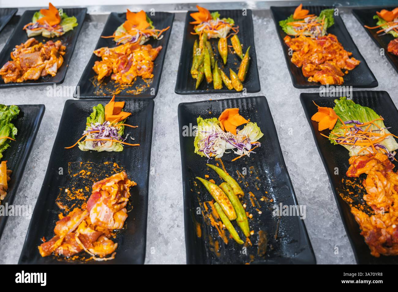 assortment of meat and various Asian vietnamese dishes at buffet in the ...