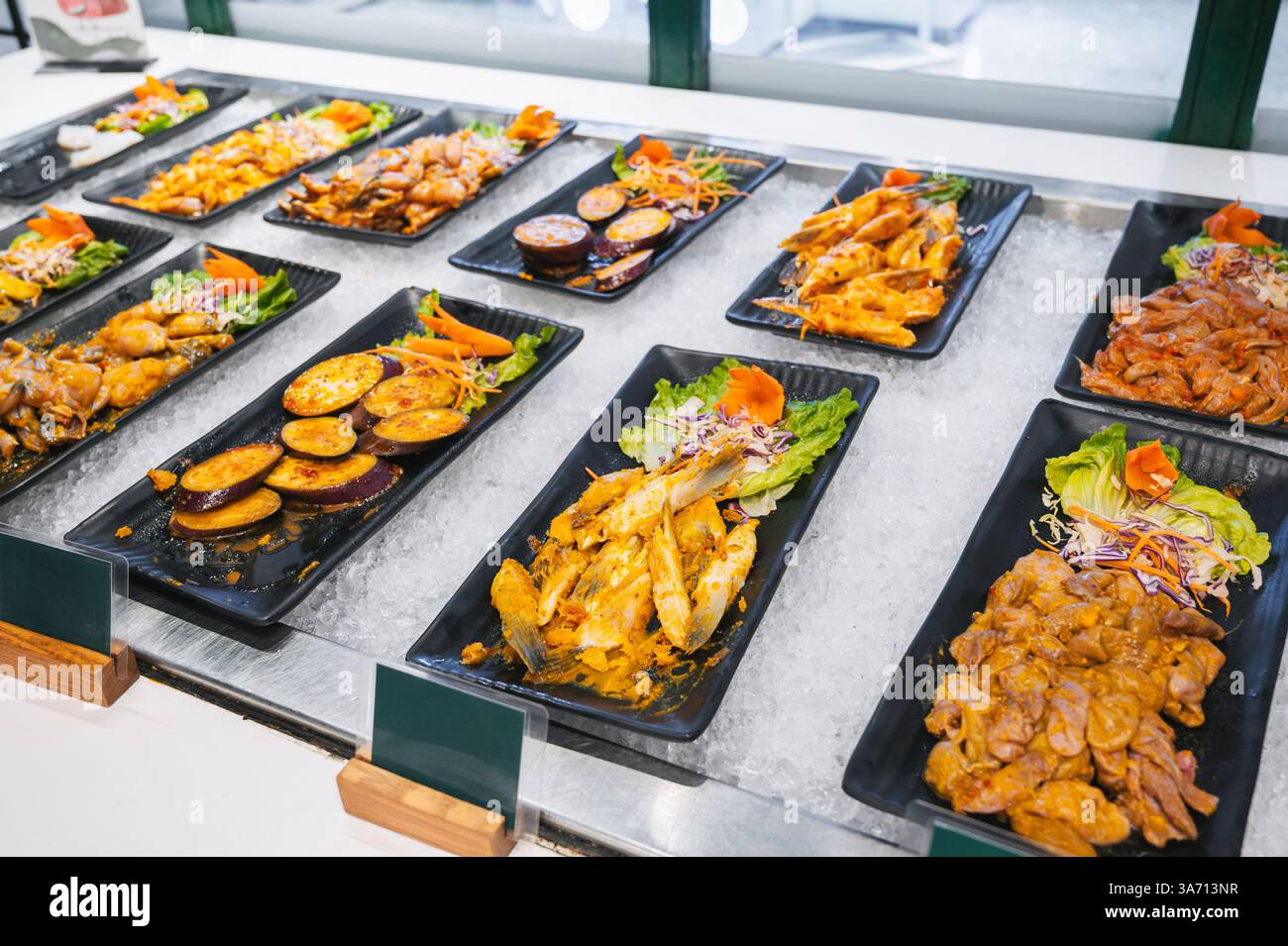 Asian buffet in hotel in Asia. Vietnamese food meat, seafood and ...