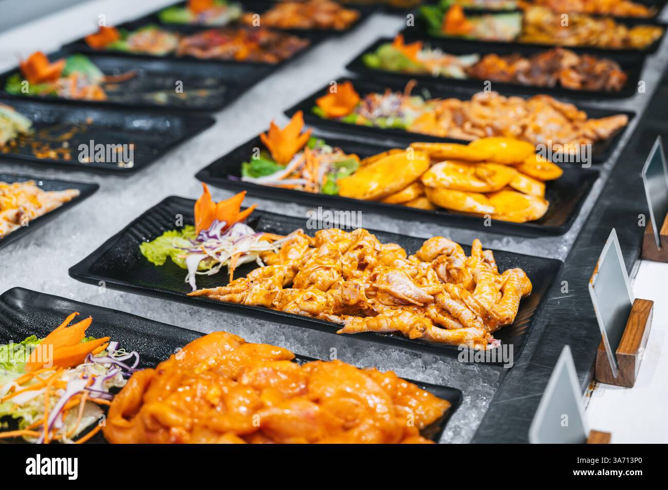 Asian meat dishes at buffet at Vietnamese self-service restaurant in ...