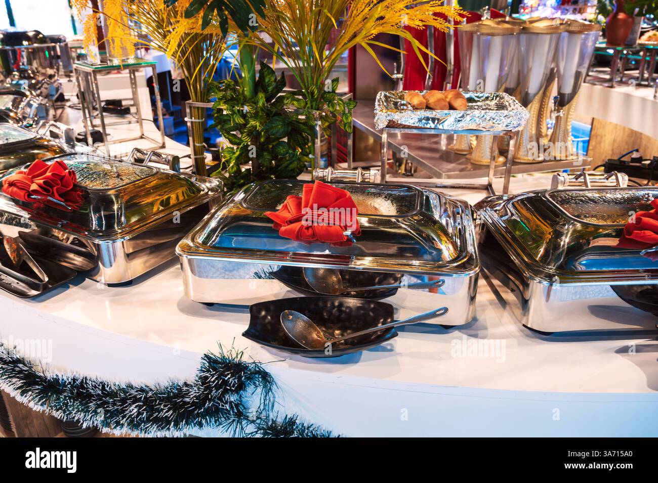 hot dishes in pots on the buffet table in the self-service restaurant ...