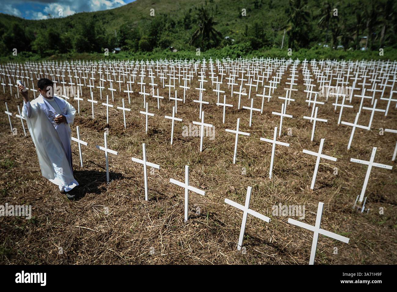 Catholic priest sprinkles holy water hi-res stock photography and ...