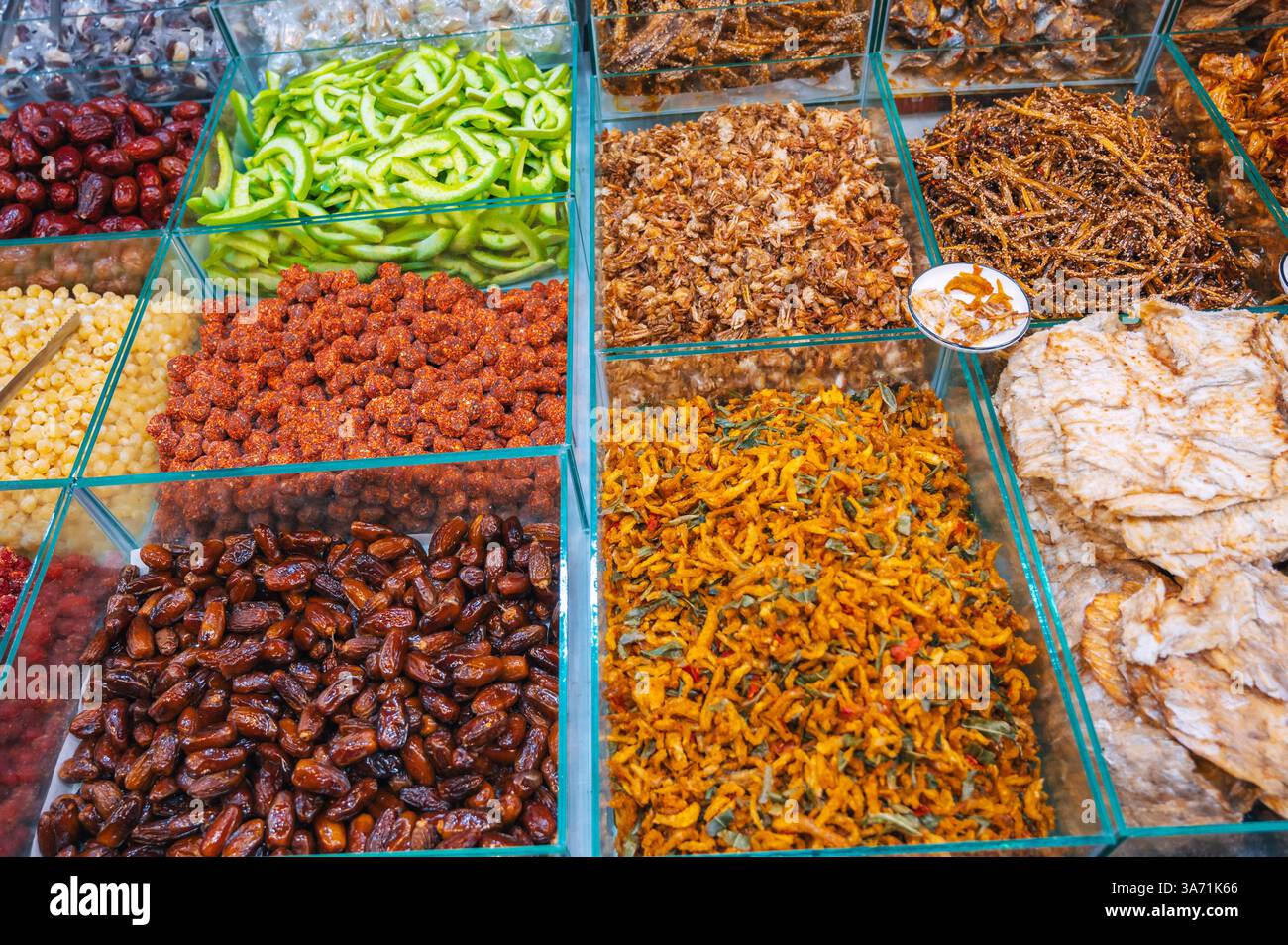 dried fish, seafood and sweet dried fruits on the counter of the Asian ...