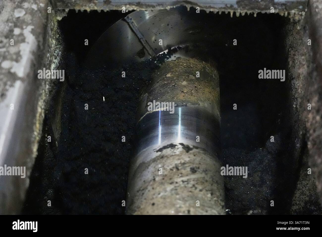 Biosolids, also known as sewage sludge, move through a centrifuge ...