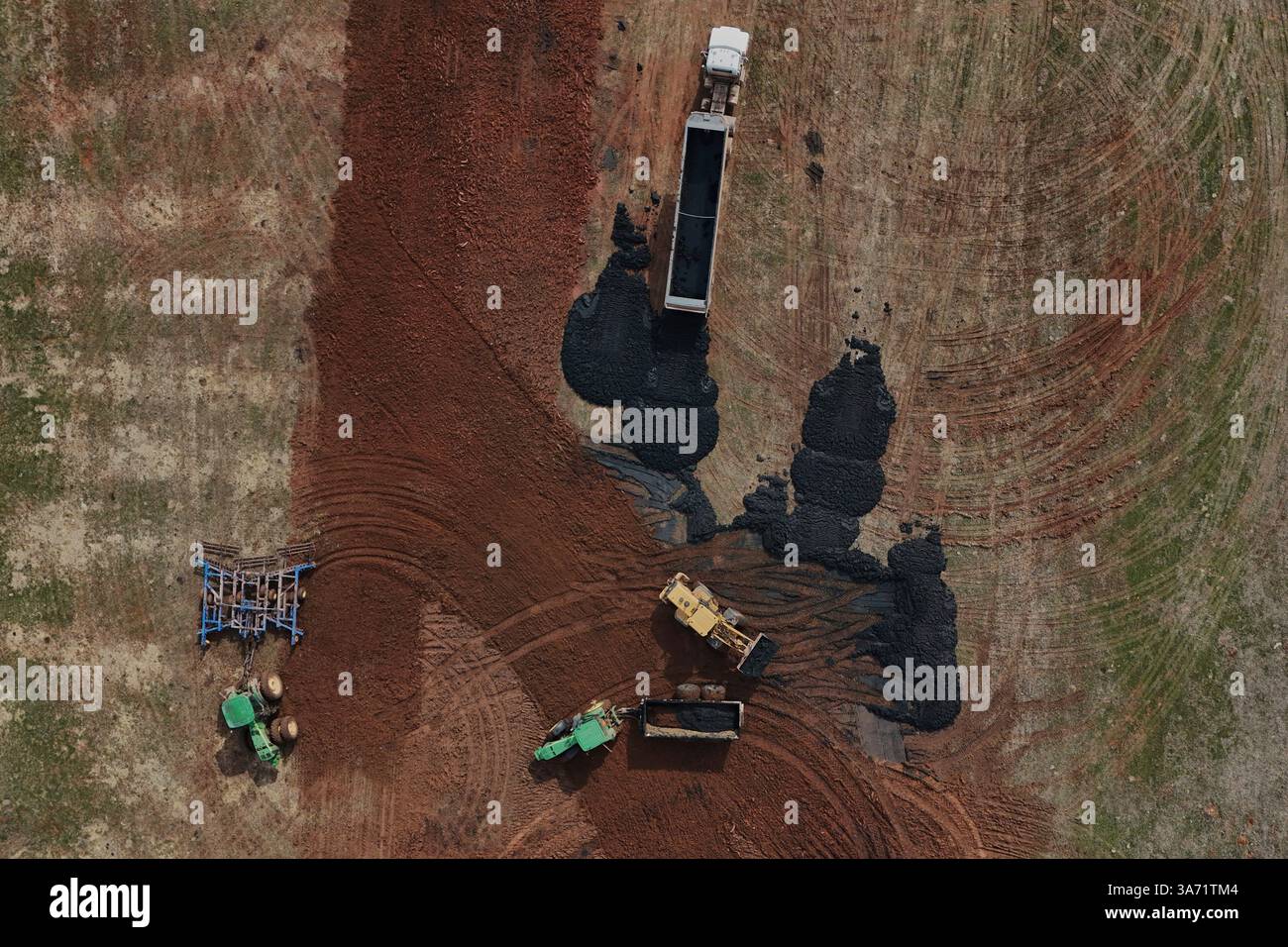 A crew applies sewage sludge to a field, Monday, Feb. 17, 2025, in ...