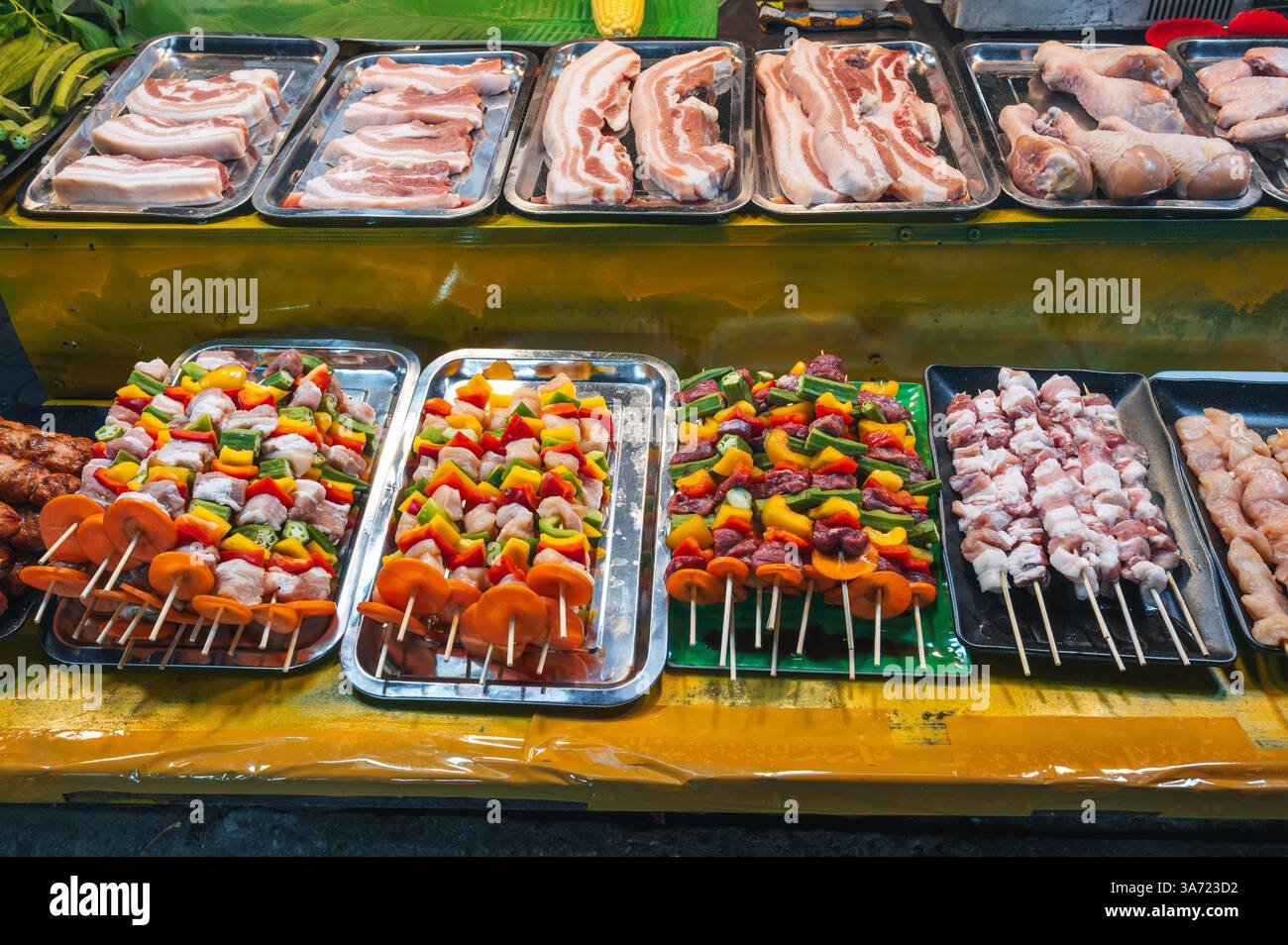 traditional Vietnamese food and meat barbecue at the Asian night market ...
