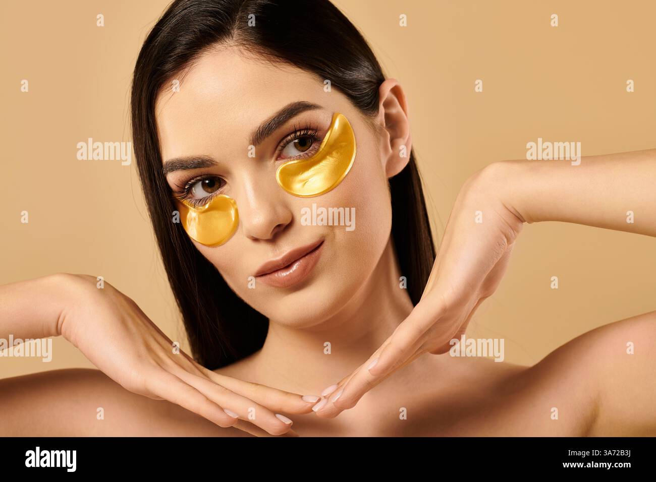 A young woman with glowing skin poses gracefully, highlighting her ...