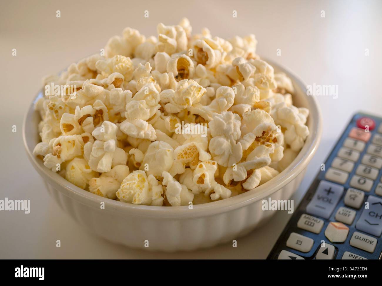 Popcorn bowl and remote control hi-res stock photography and images - Alamy