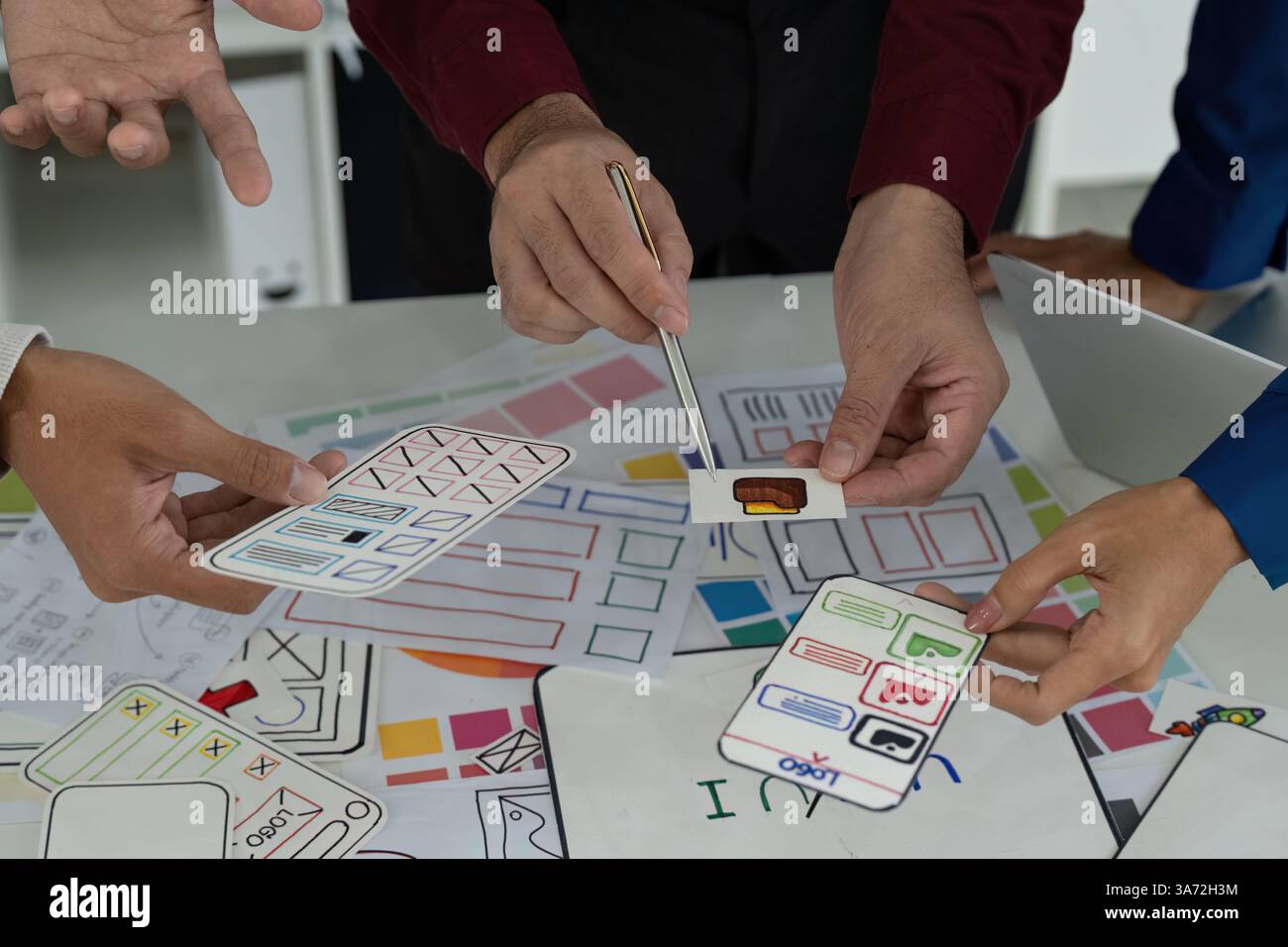 Creative Teamwork in UX UI Design. Designers engaging in a lively ...