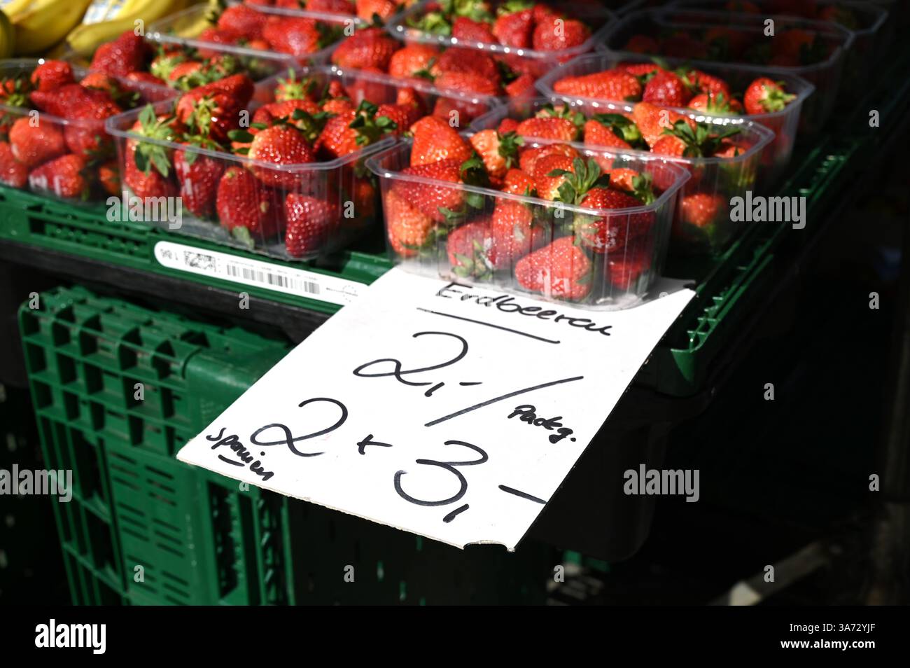 Leipzig, Germany. 18th Mar, 2025. Strawberries with a price tag are on ...