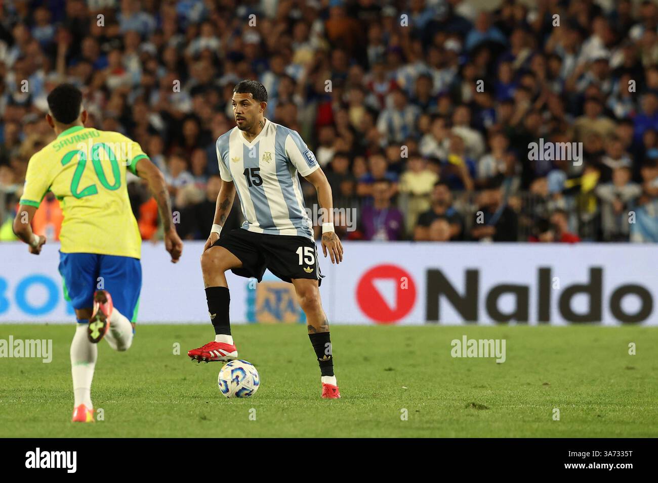 Argentinas defender Facundo Medina C controls the ball next Brazil s ...