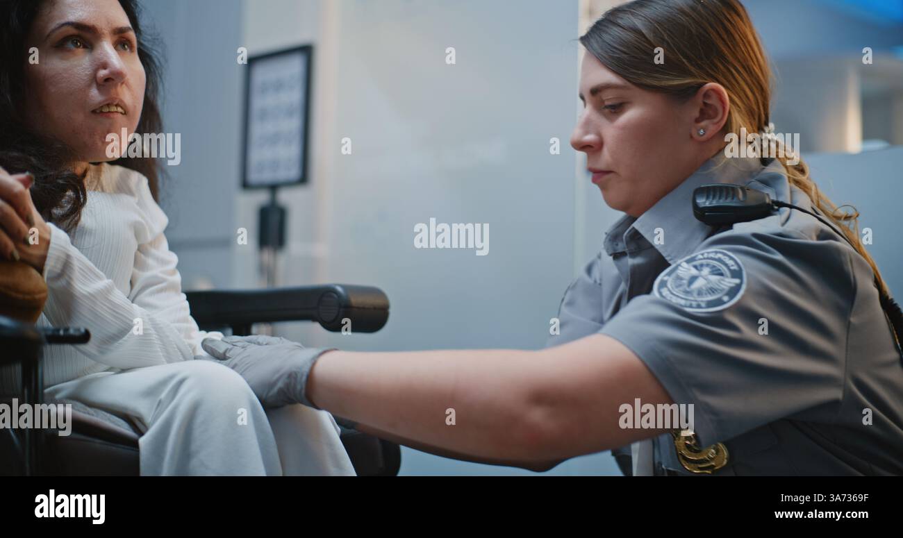 Security Checkpoint: Close Up of Female TSA Officer Checking Woman with Disability in Airport ...