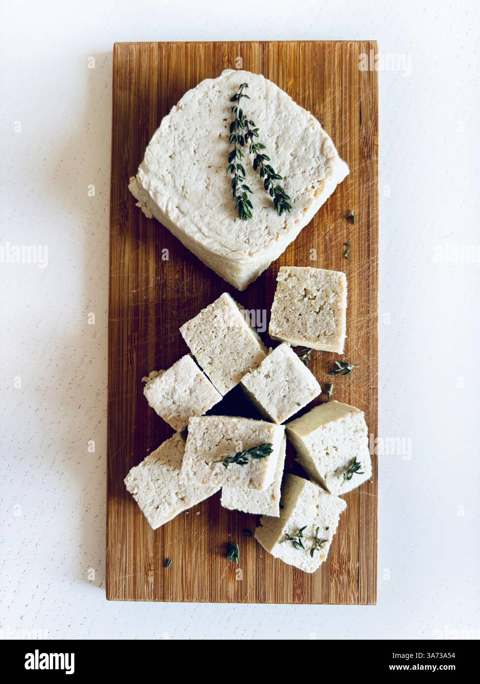Asian cuisine. Tofu or soy cheese. Sliced and whole raw tofu, soybean ...