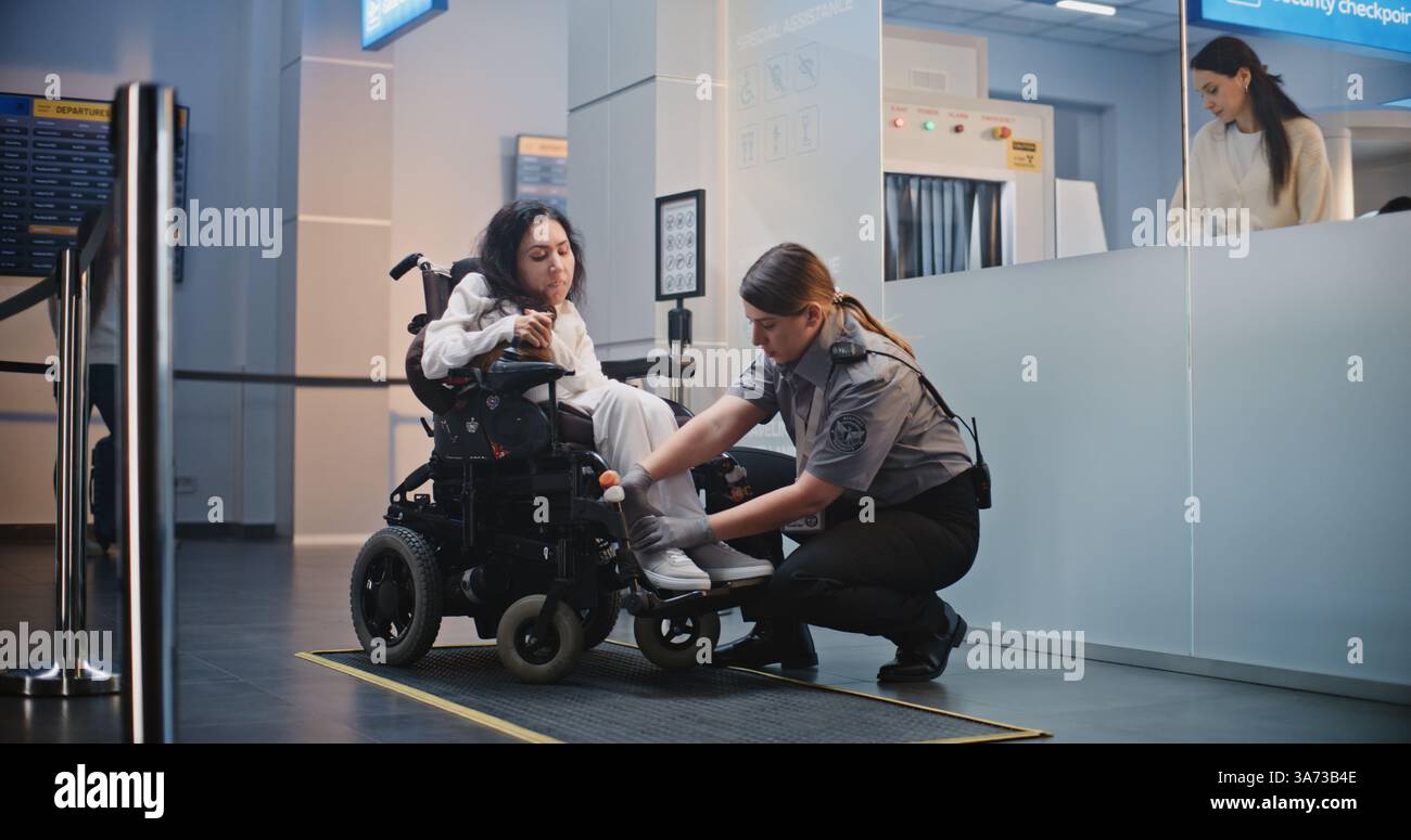 Security Checkpoint in Airport Terminal: Female Security Officer Inspecting Woman in Wheelchair ...