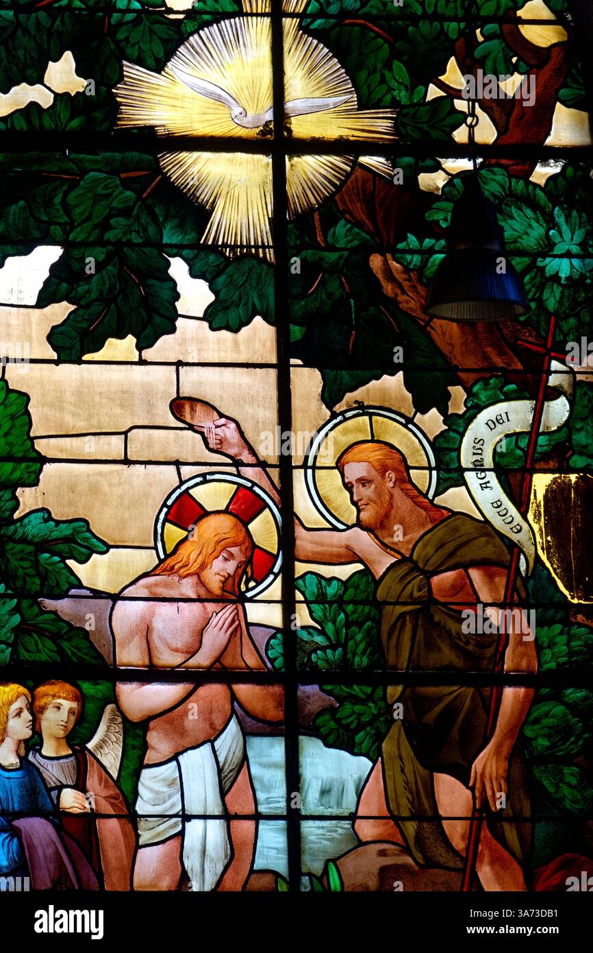Pantin, FRANCE - 09-29-2024: Stained glass (1926) of Baptism of Jesus by John the Baptist in the ...