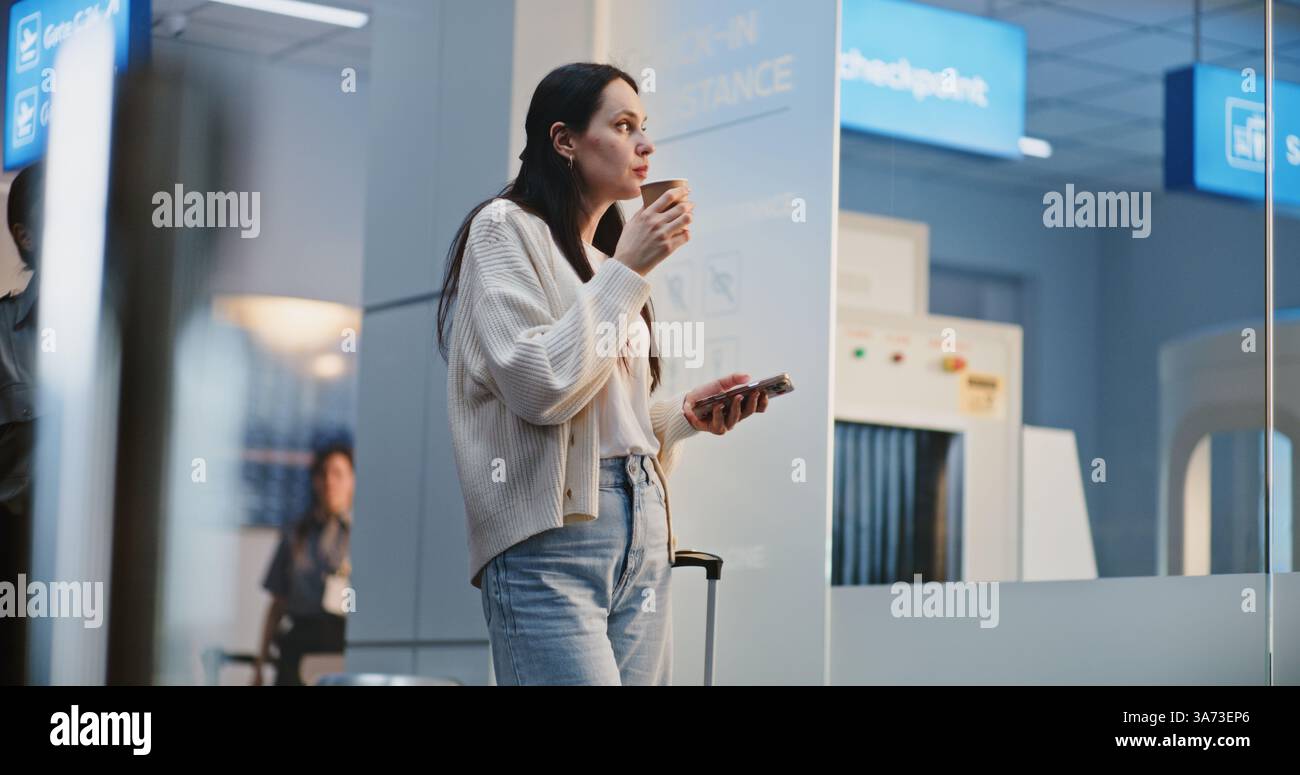 Busy Airport Terminal: Adult Woman Scrolling on Smartphone, Drinking Coffee, Waiting for Flight ...