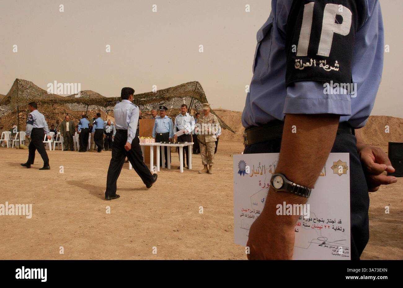 Apr 22, 2004; Ar Ramadi, Iraq; Newly-graduated Iraqi policemen receive ...