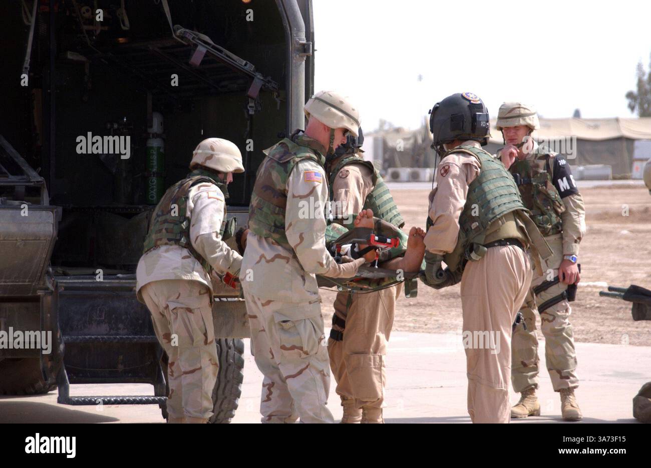 Apr 26, 2004; Al Asad, Iraq; Army Staff Sgt. BRYAN P. RESH, medic, and ...