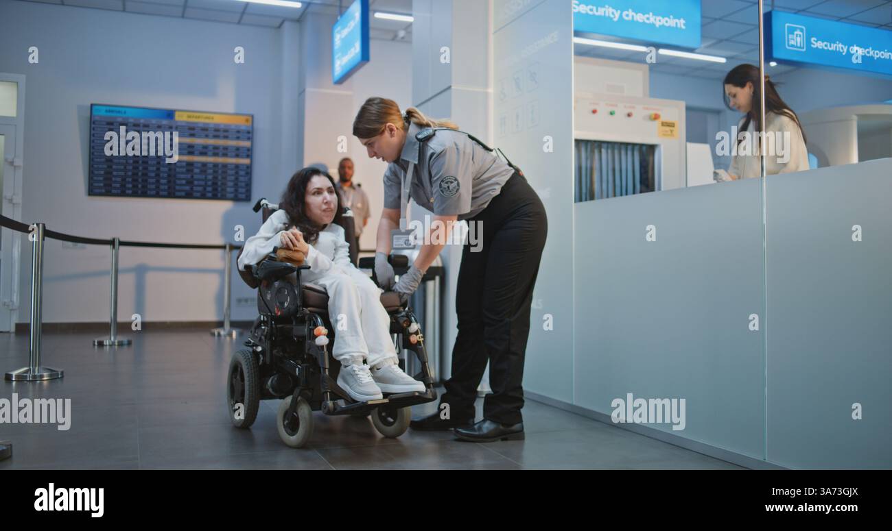 Airport Worker Walks with Passenger with Disability at Security ...
