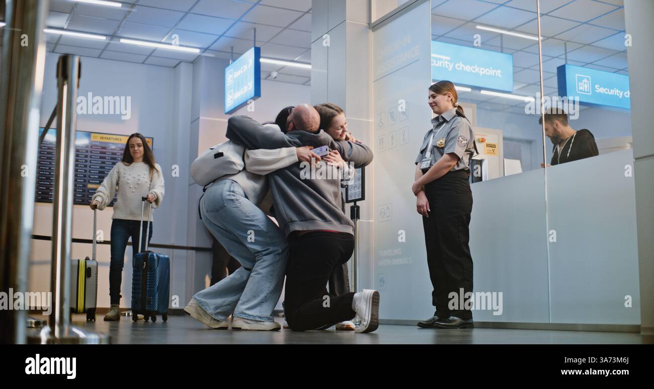 Emotional Family Reunion in Airport Terminal: Happy Man Greeting His ...