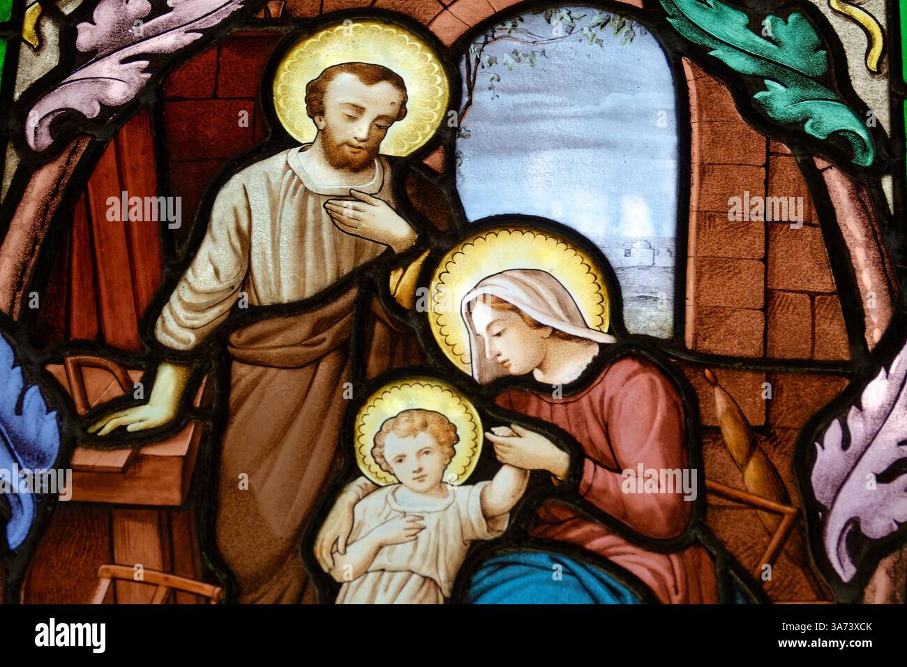 Paris, FRANCE - 10-14-2024: Stained glass (19th century) of Holy family ...