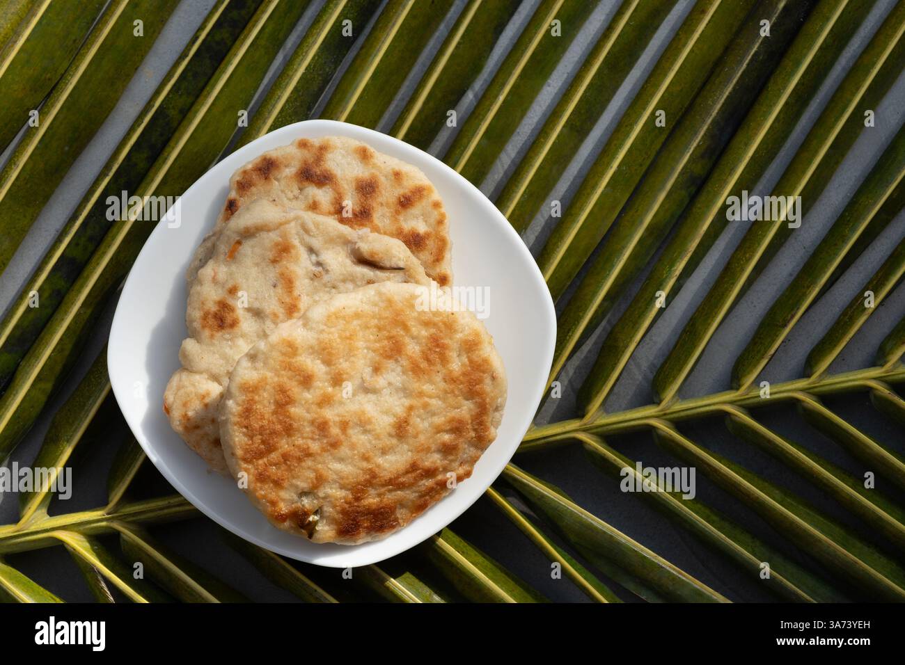 Amazing Sri Lankan three Pol Coconut Roti in white plate. Traditional ...