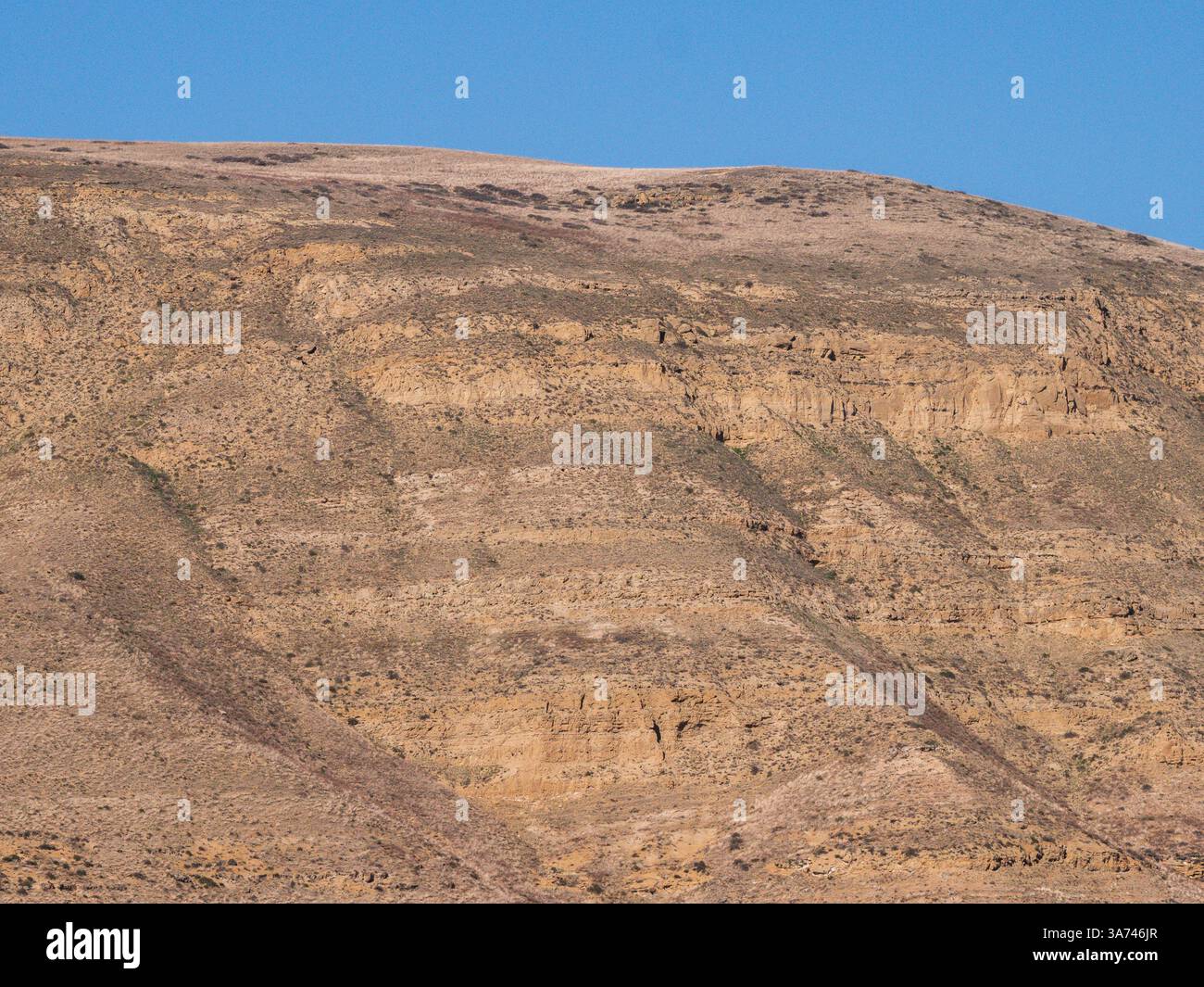 The rugged hills showcase layers of sandstone. Sandstone forms a ...