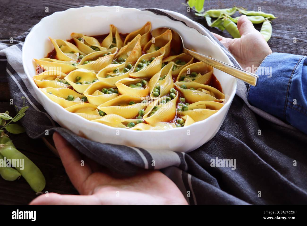 Stuffed Shells with Peas and Cheese in Tomato Sauce Stock Photo - Alamy