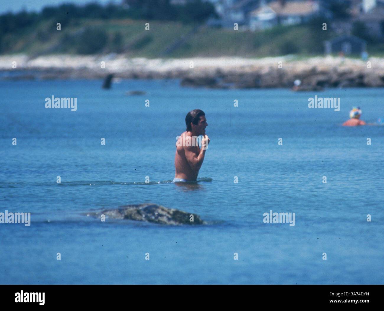 Jul 08, 1983; Providence, RI, USA; JOHN F. KENNEDY JR swimming during ...