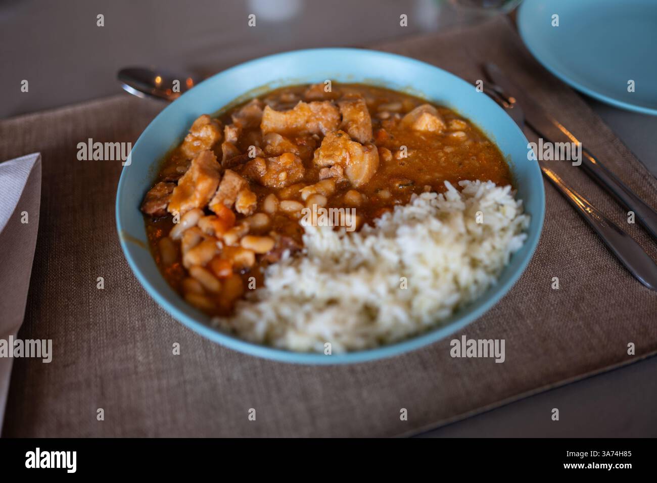 Pork feijoada dish on restaurant table Stock Photo - Alamy