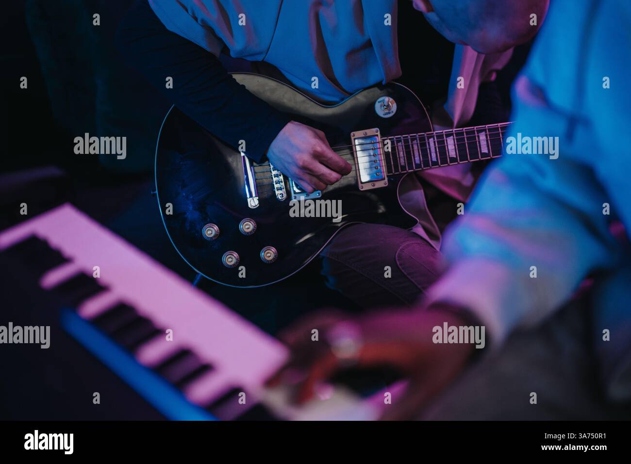 Diverse musicians collaborating on music production in a studio ...