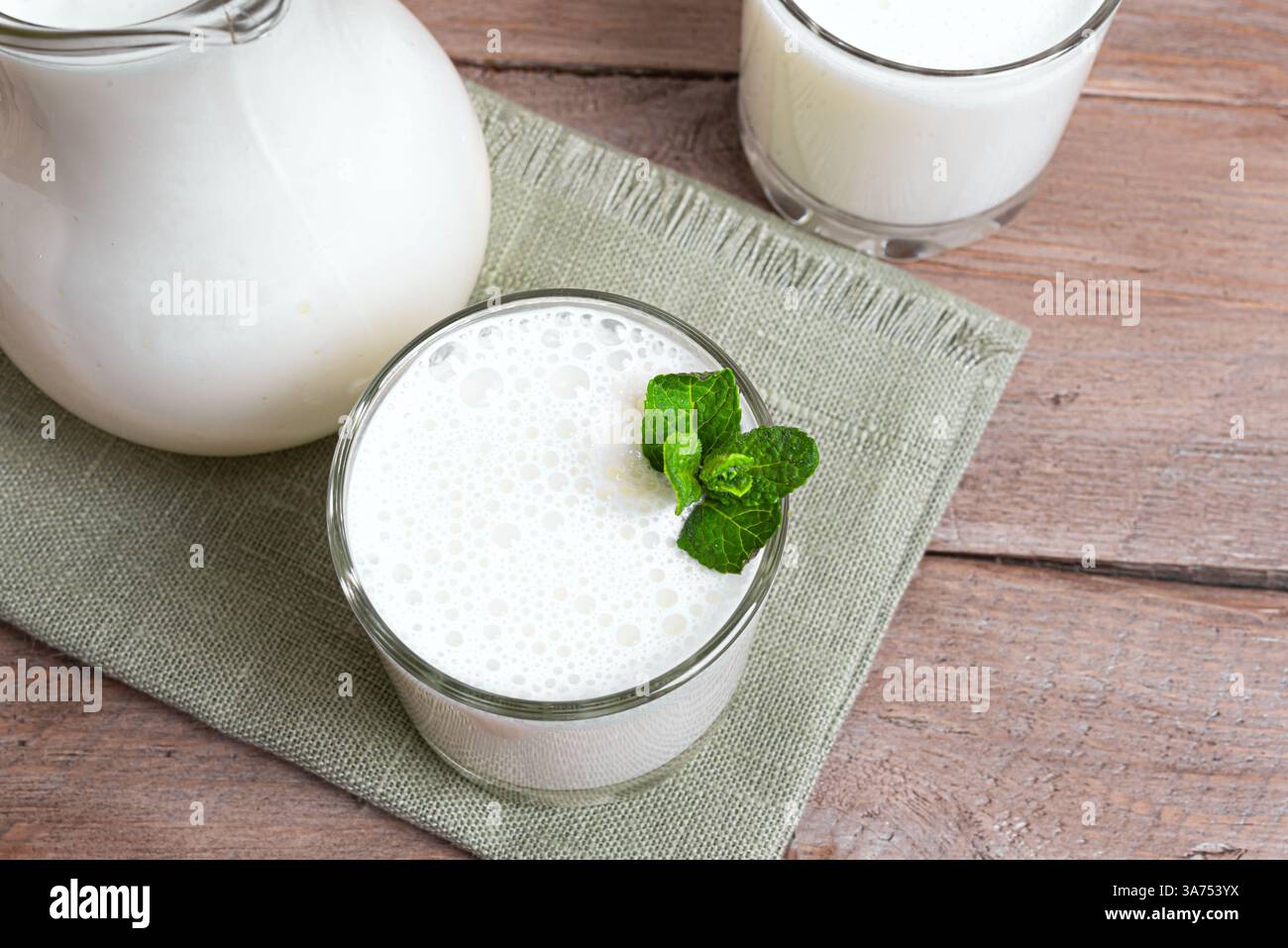 Glass of Turkish traditional drink ayran, kefir or buttermilk, homemade ...