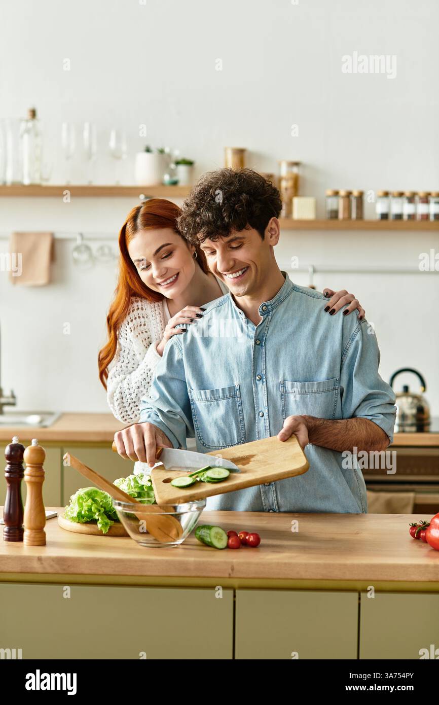 A loving couple shares joyful moments in their kitchen as they cook ...
