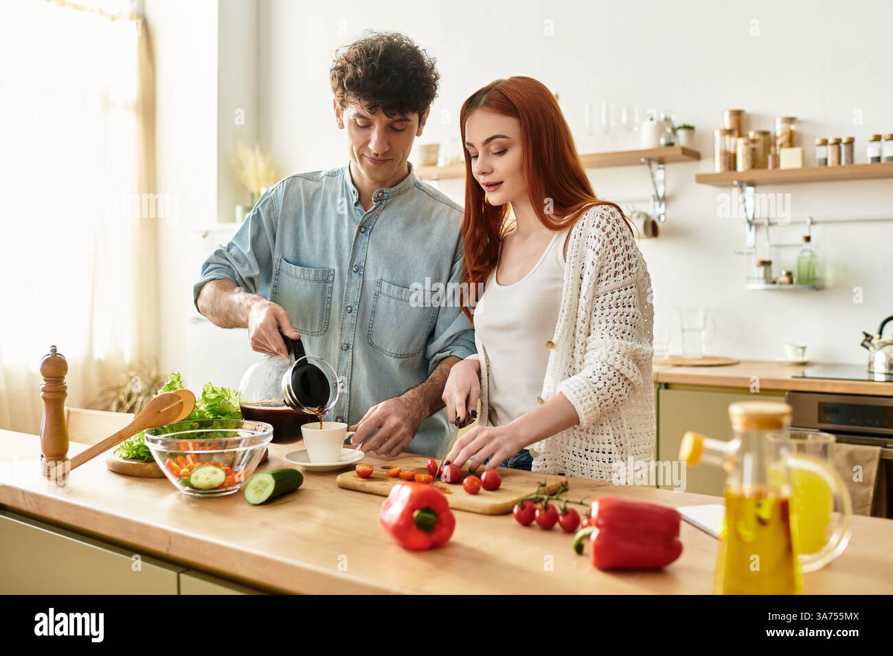 Loving couple enjoys a joyful moment cooking together in their kitchen ...