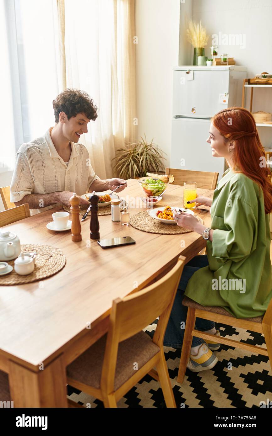 A young couple shares a delightful breakfast, celebrating their bond in ...
