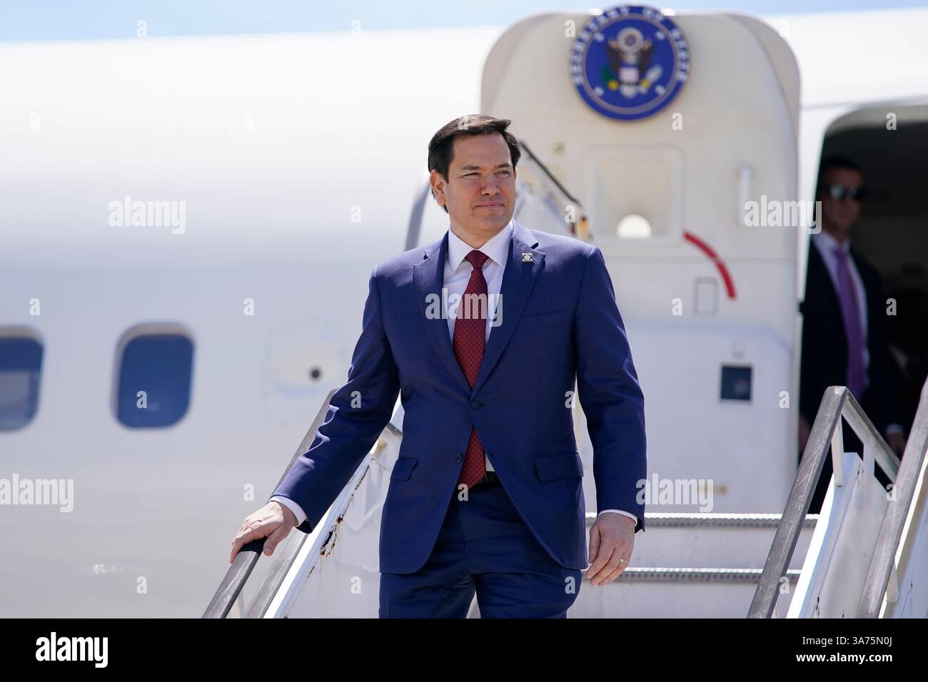 U.S. Secretary of State Marco Rubio disembarks a plane as he arrives at ...