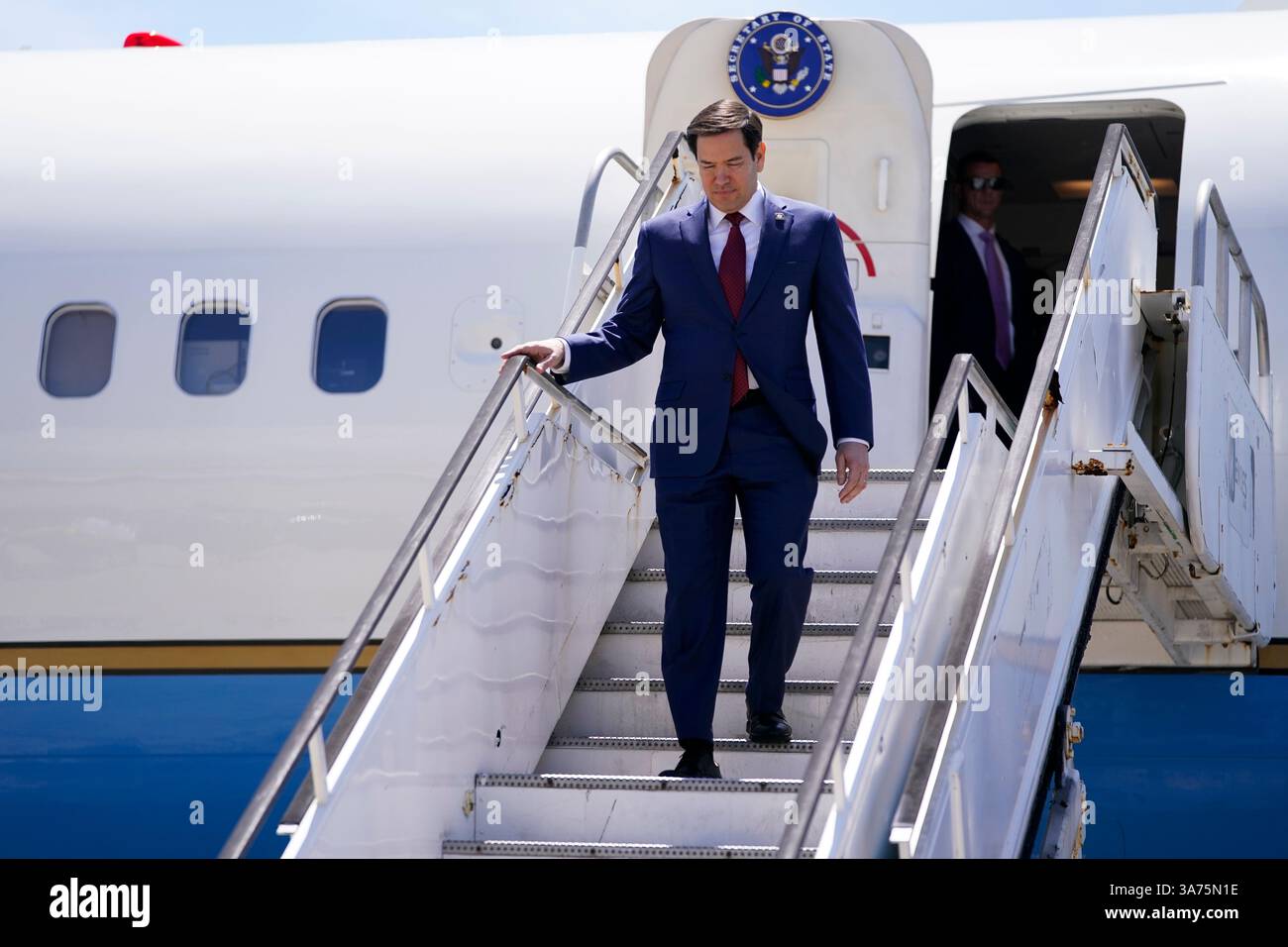 U.S. Secretary of State Marco Rubio disembarks a plane as he arrives at ...
