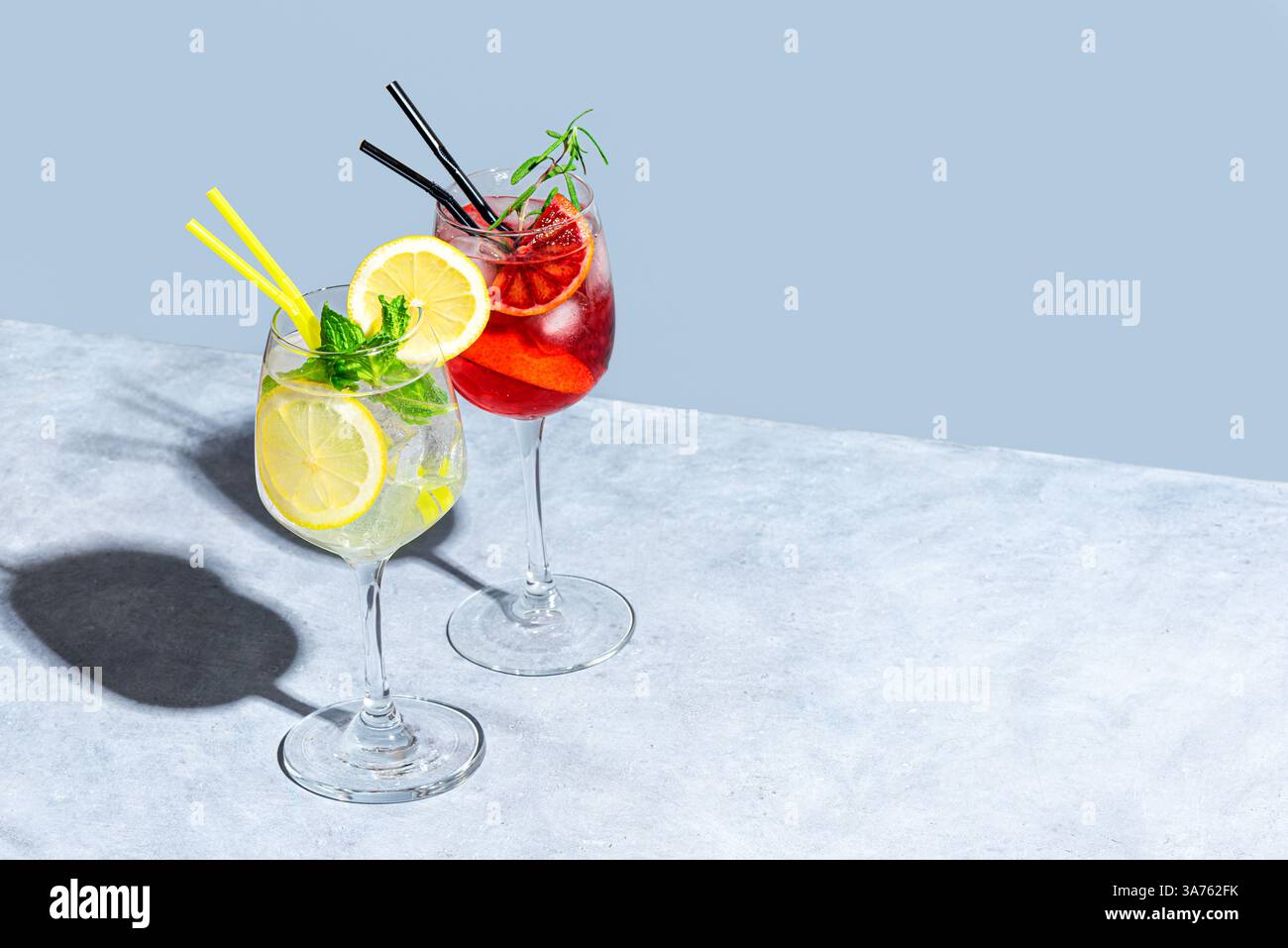 Summer Spritzer Cocktails on gray concrete background. White wine ...