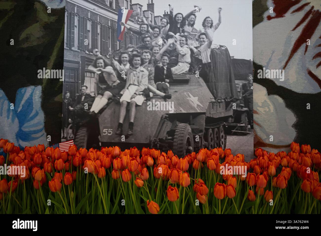A large photo of the liberation of the Netherlands sits among a display ...