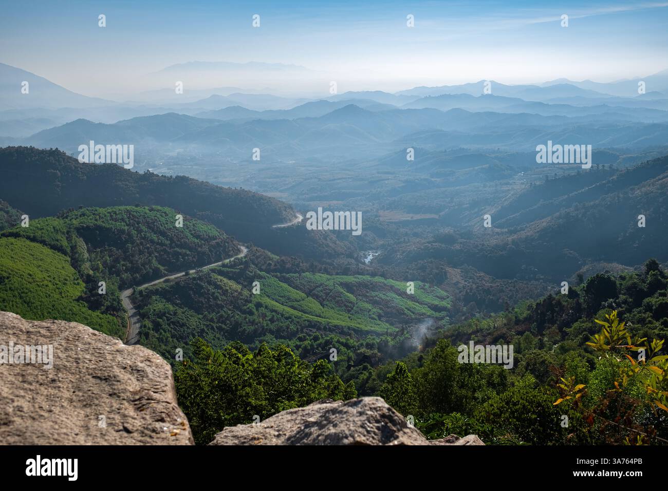 Tropical rainforest and mountains in Vietnam Asia. View of a curvy road ...