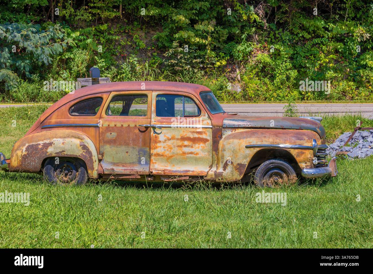 An old rusty car sits abandoned along side a country road in rural Tennessee, USA Stock Photo ...
