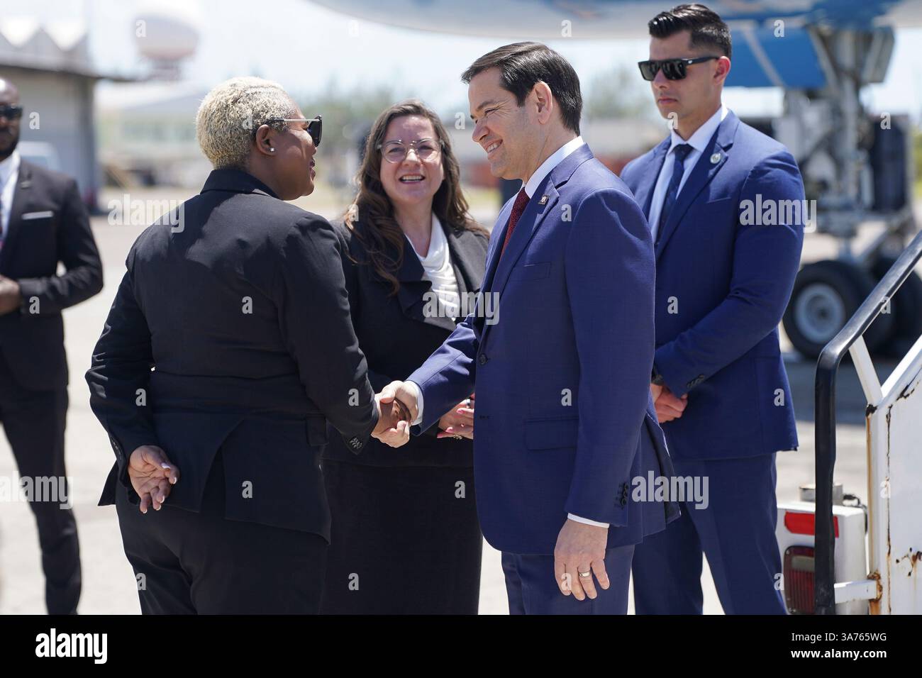 U.S. Secretary of State Marco Rubio is greeted by the local delegation ...