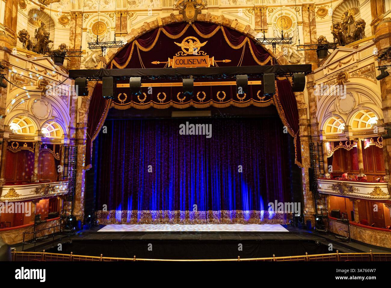 interior of the London Coliseum showing the proscenium arch, front curtain, orchestra pit and ...