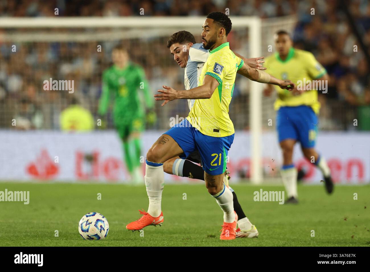 Brazil s Matheus Cunha front vies for the ball with Argentinas forward ...