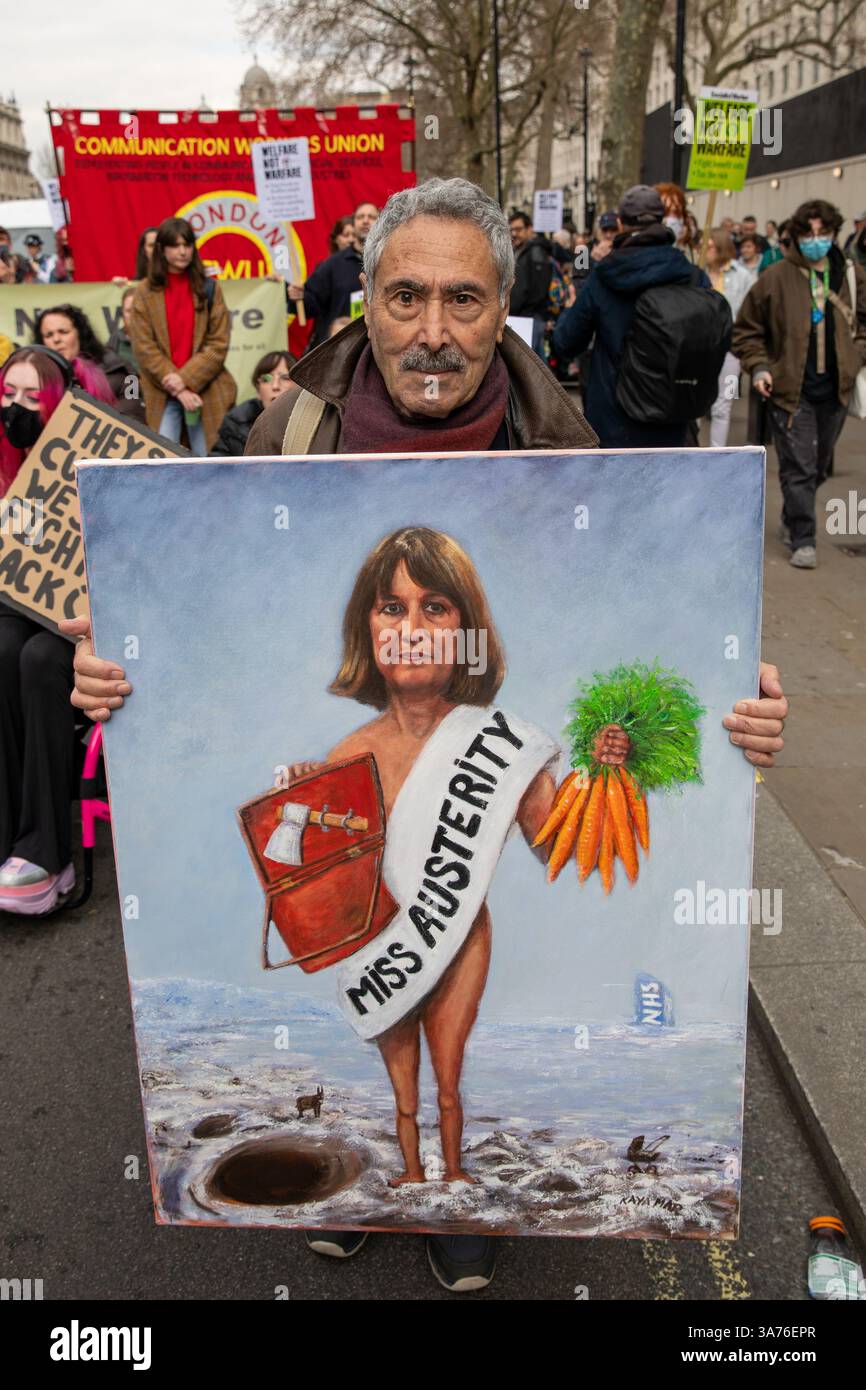 London, UK. 26th Mar, 2025. A protestor holds a picture of Chancellor ...