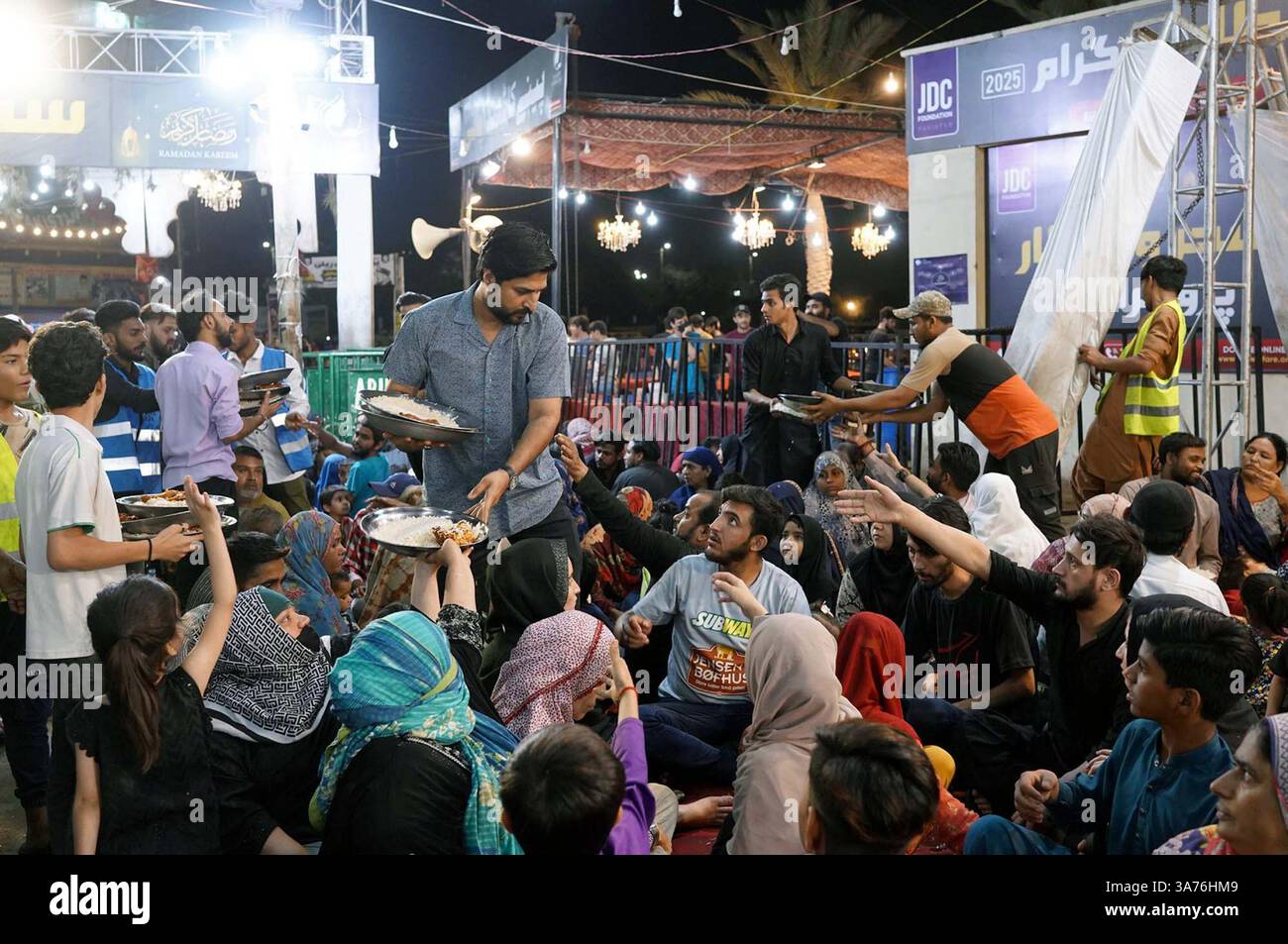 Faithful Muslims are having sehri during Grand Sehri Dastarkhuwan ...