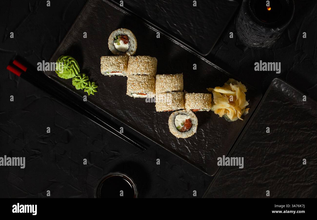 roll with tuna on black shale. Japanese food Stock Photo - Alamy