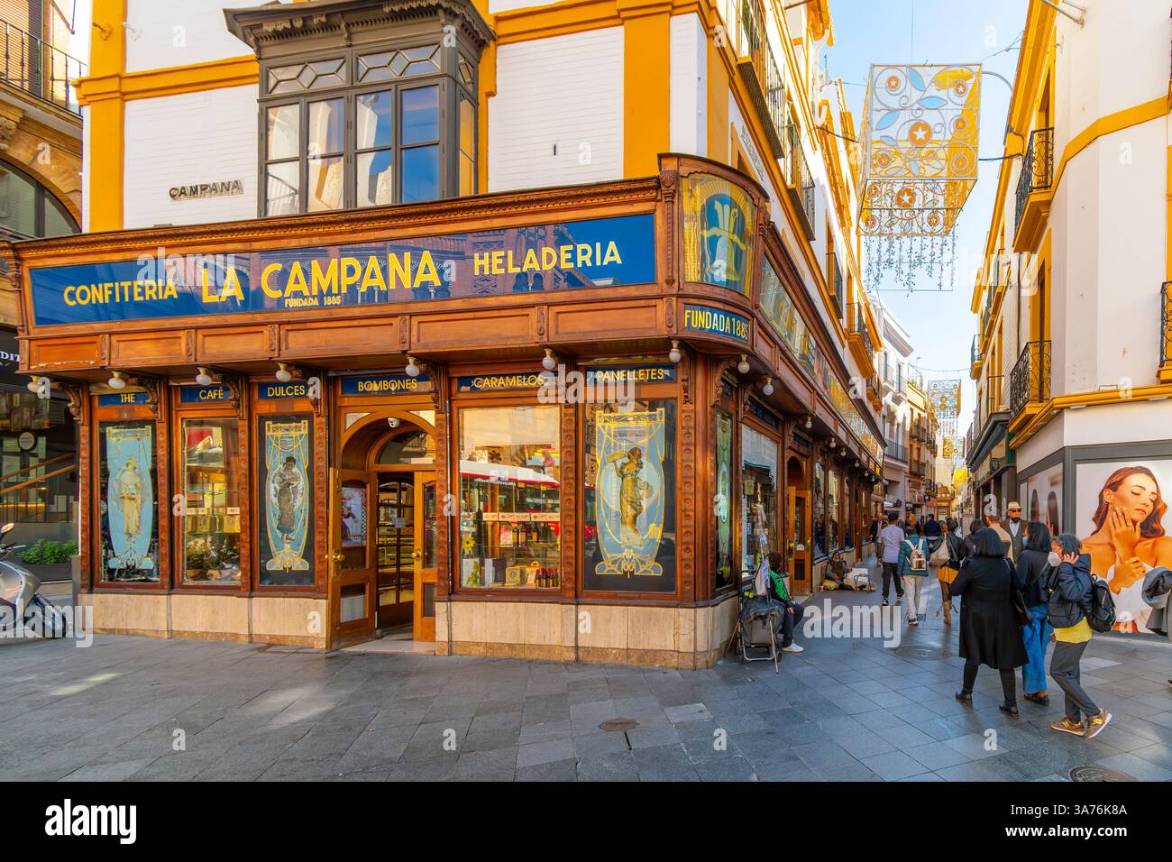 A busy alley full of shops, markets and cafes in the historic downtown ...